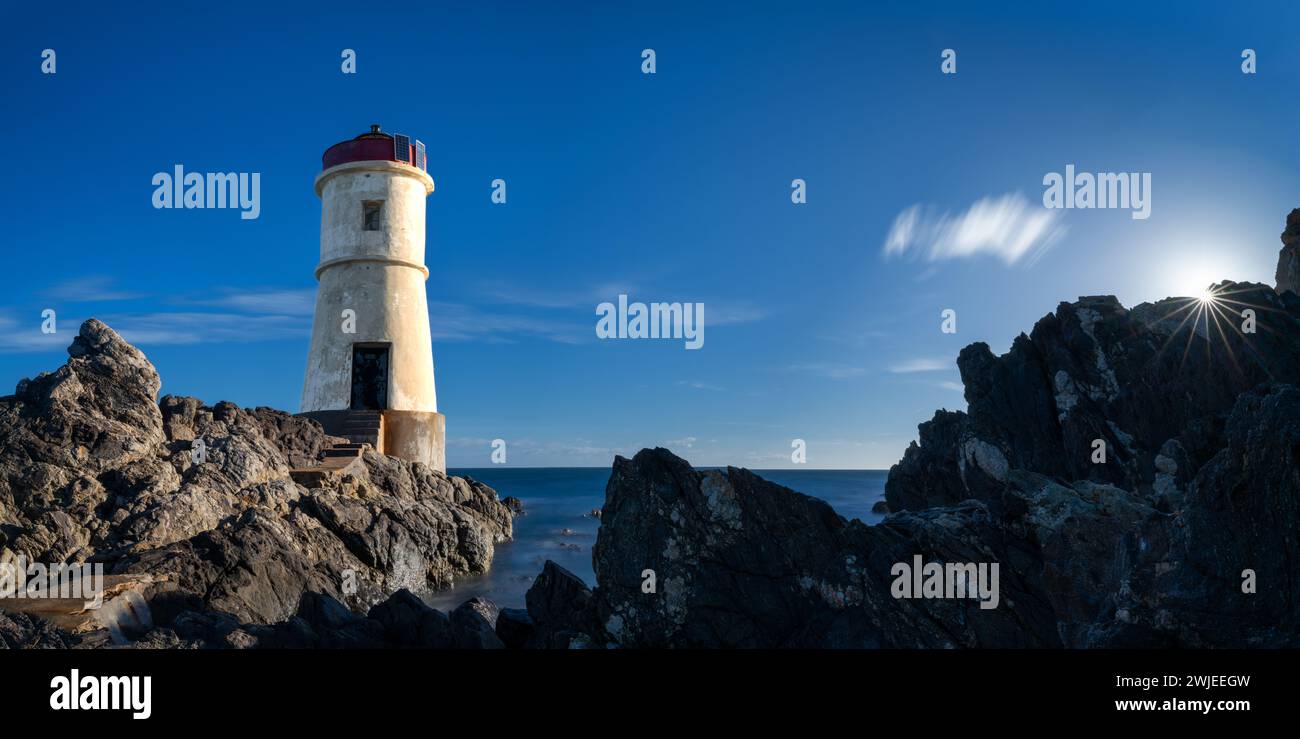 A panorama landscape view of the old Capo Ferro Lighthouse in Sardinia ...