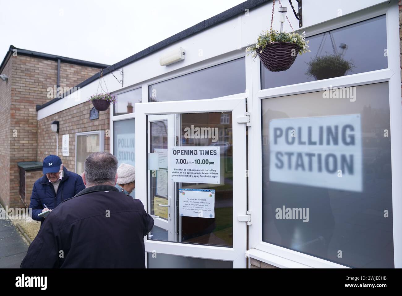 People arrive at Irchester Village Hall, as voting gets underway in the ...