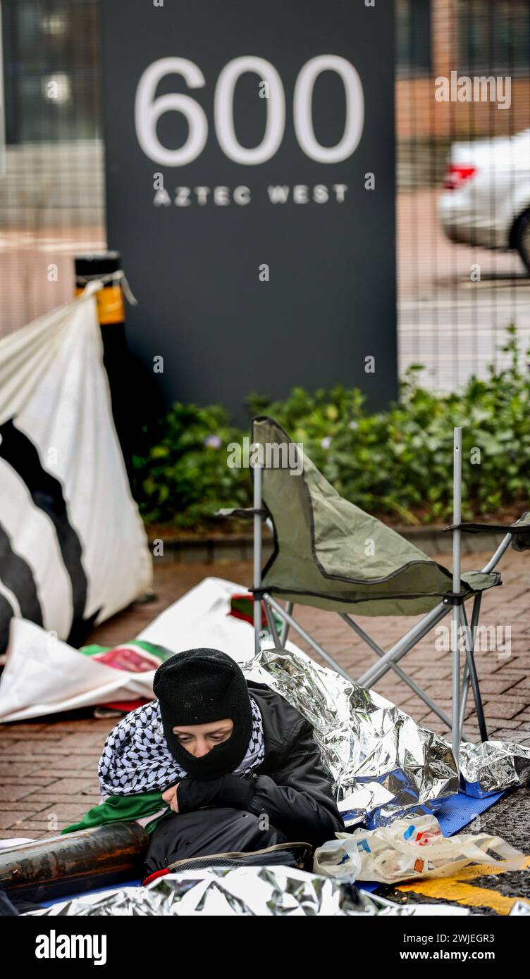 Protester wearing a Balaclava and attached to a metal lock-on takes up ...
