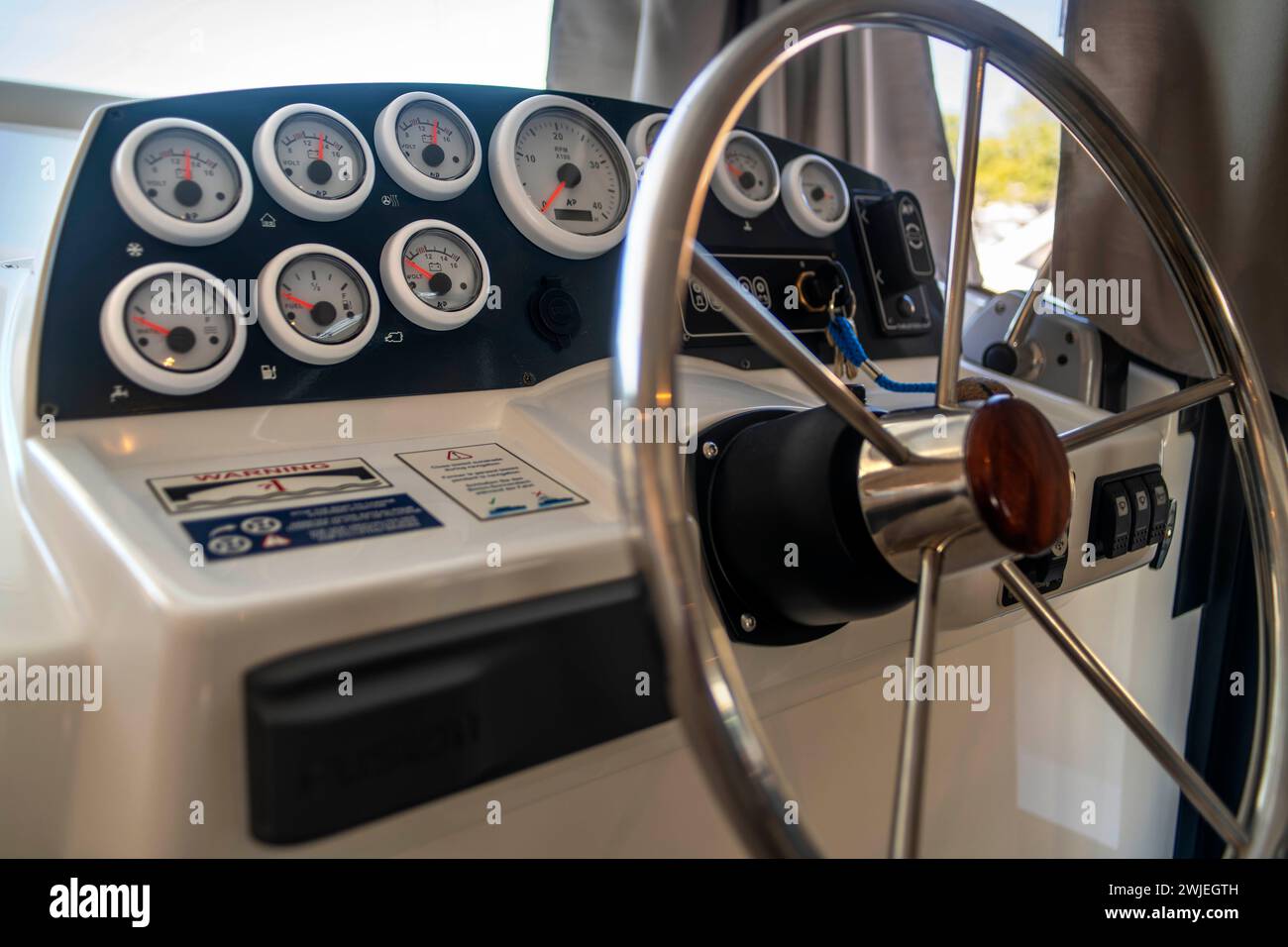 Steering wheel and controls to pilot inside a boat for a rent in the ...