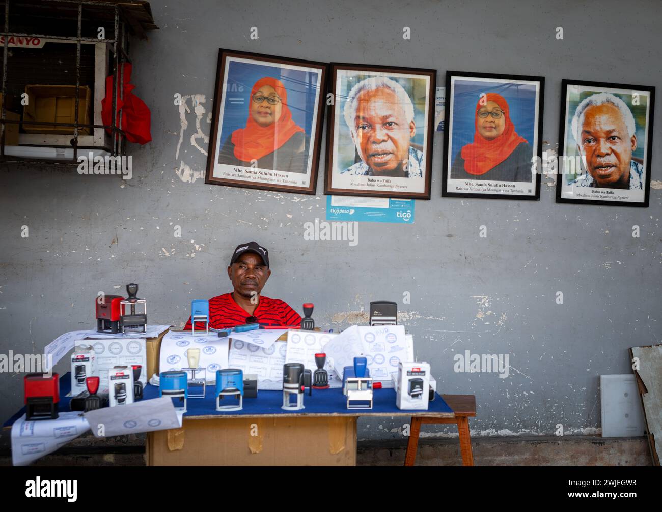 A man selling stamping devices and portraits of former president Julius ...