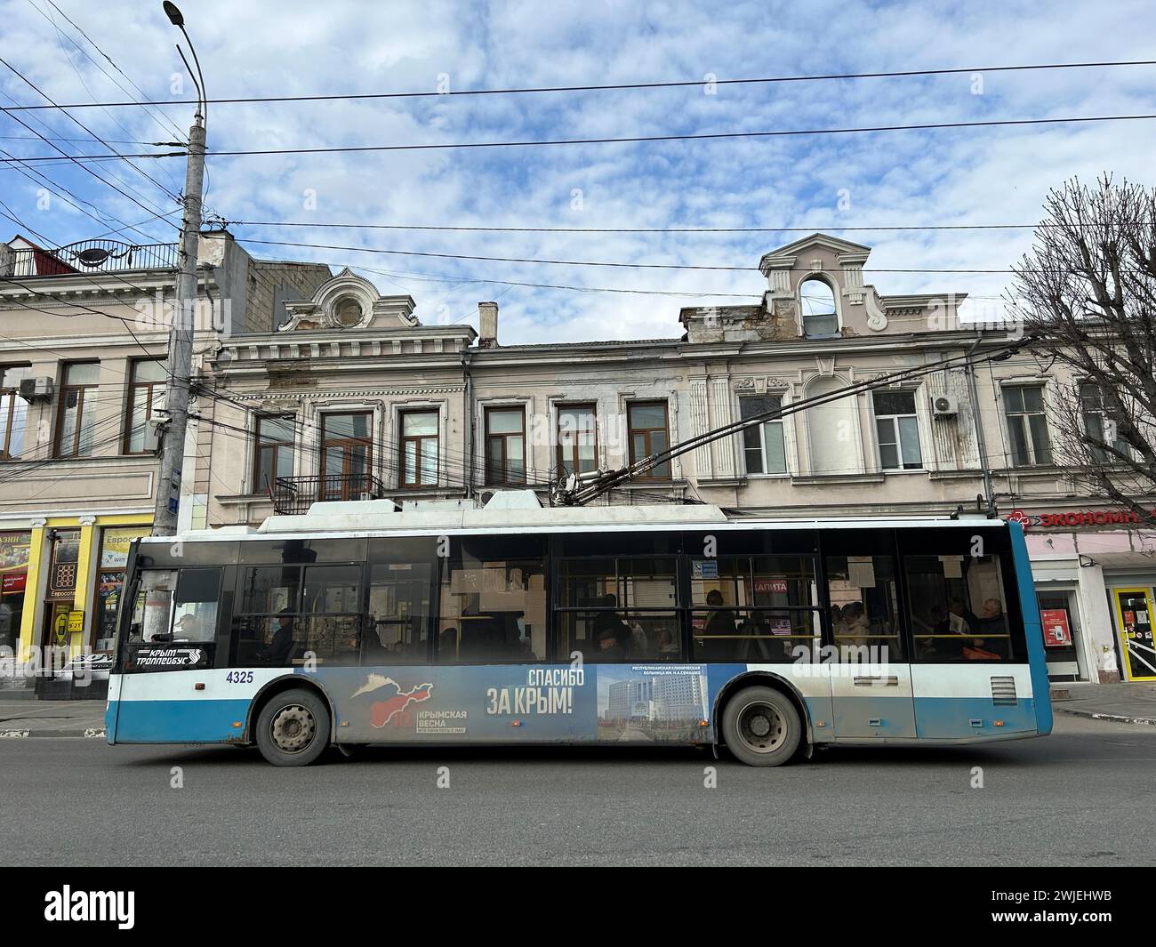 Simferopol, Ukraine. 13th Feb, 2024. A trolley bus drives through the ...