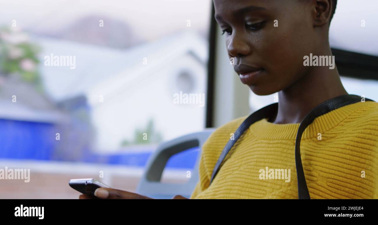 Boy texting with floating message icons Stock Photo - Alamy