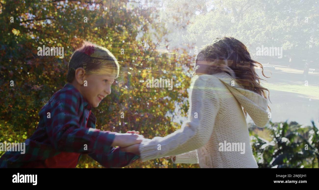 Kids playing in a park with trees and grass Stock Photo - Alamy