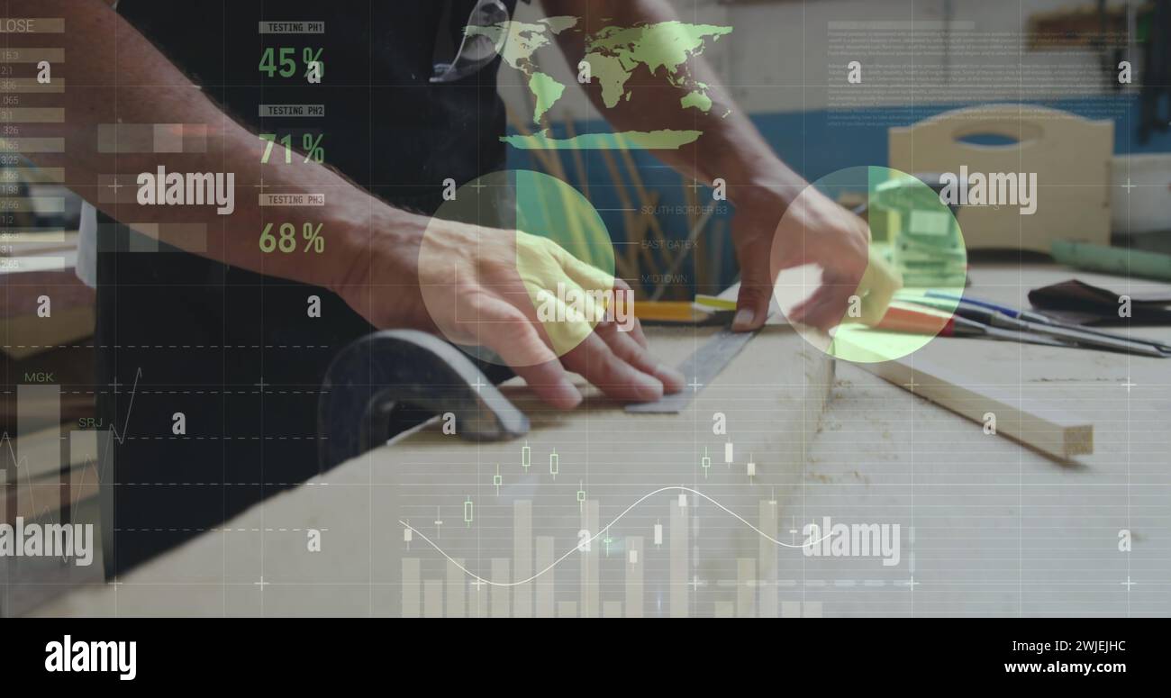 Two men building in a workshop with graphs and stats Stock Photo - Alamy