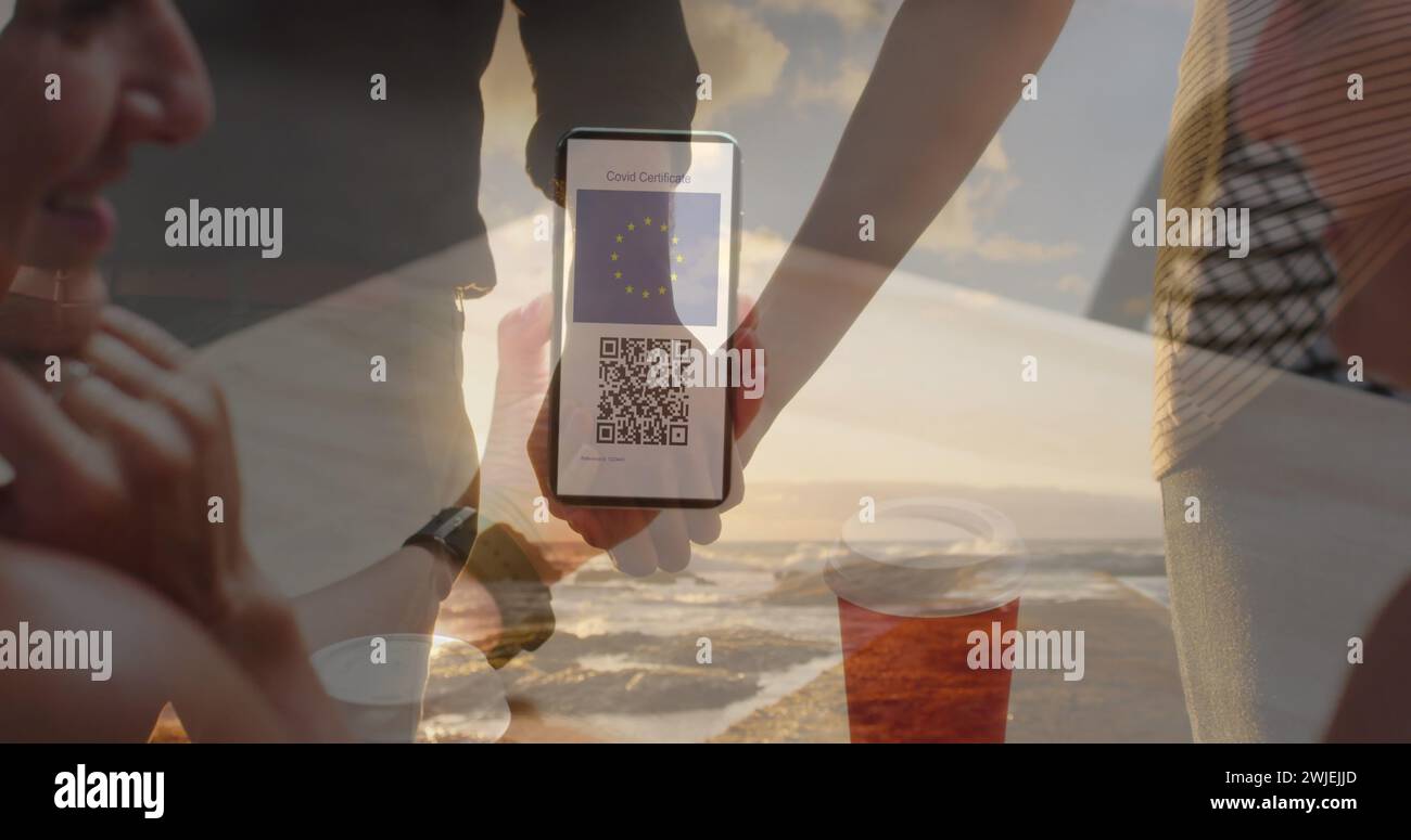 Woman holding a smartphone with qr code on screen against couple ...