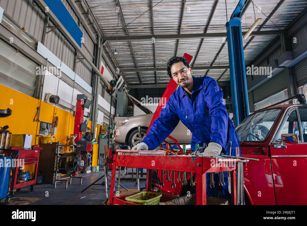 Portrait Asian Japanese male mechanic worker portrait in auto service ...