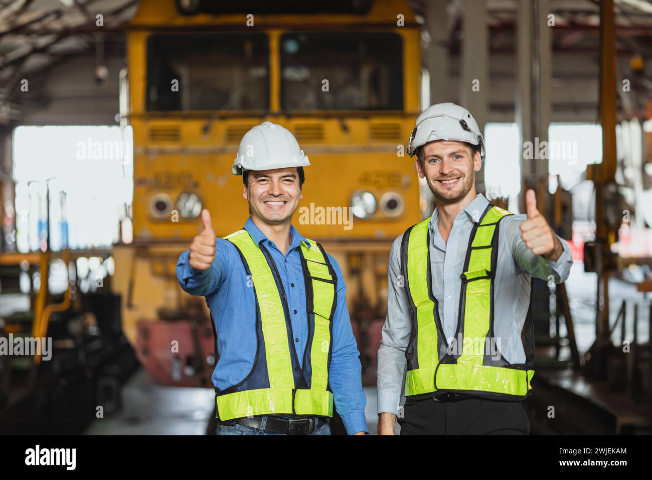 engineer male team staff worker happy smile work in locomotive depot ...