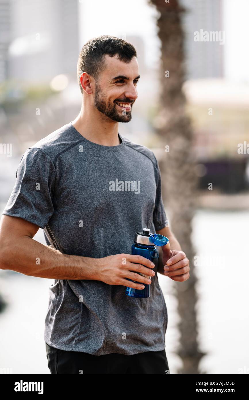Runner drinks water from bottle hi-res stock photography and images - Alamy