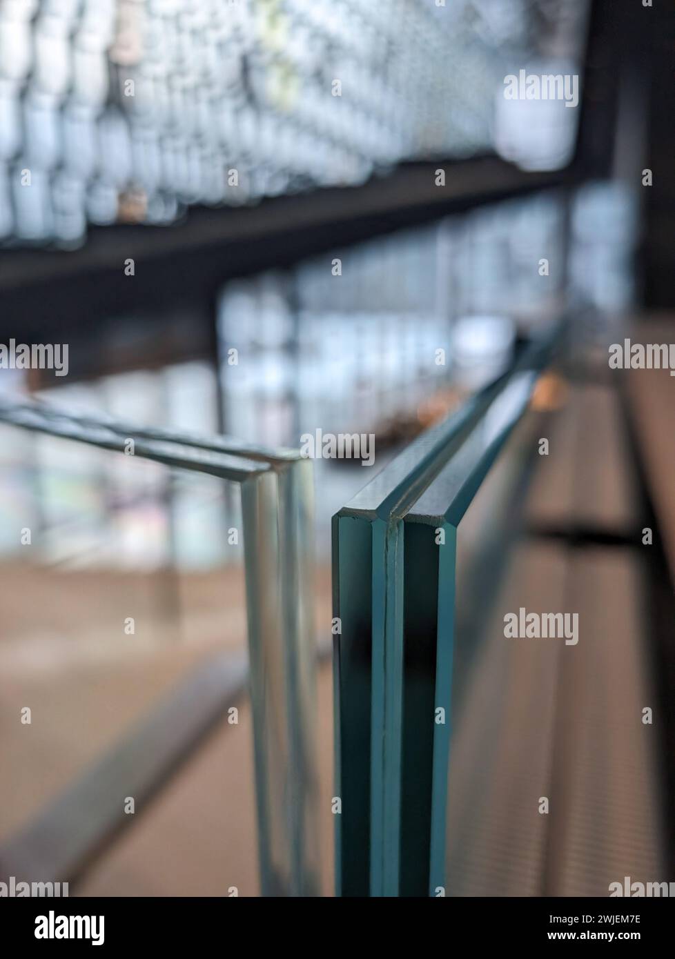 Metal-framed glass doors with a sleek metal bar counter Stock Photo - Alamy