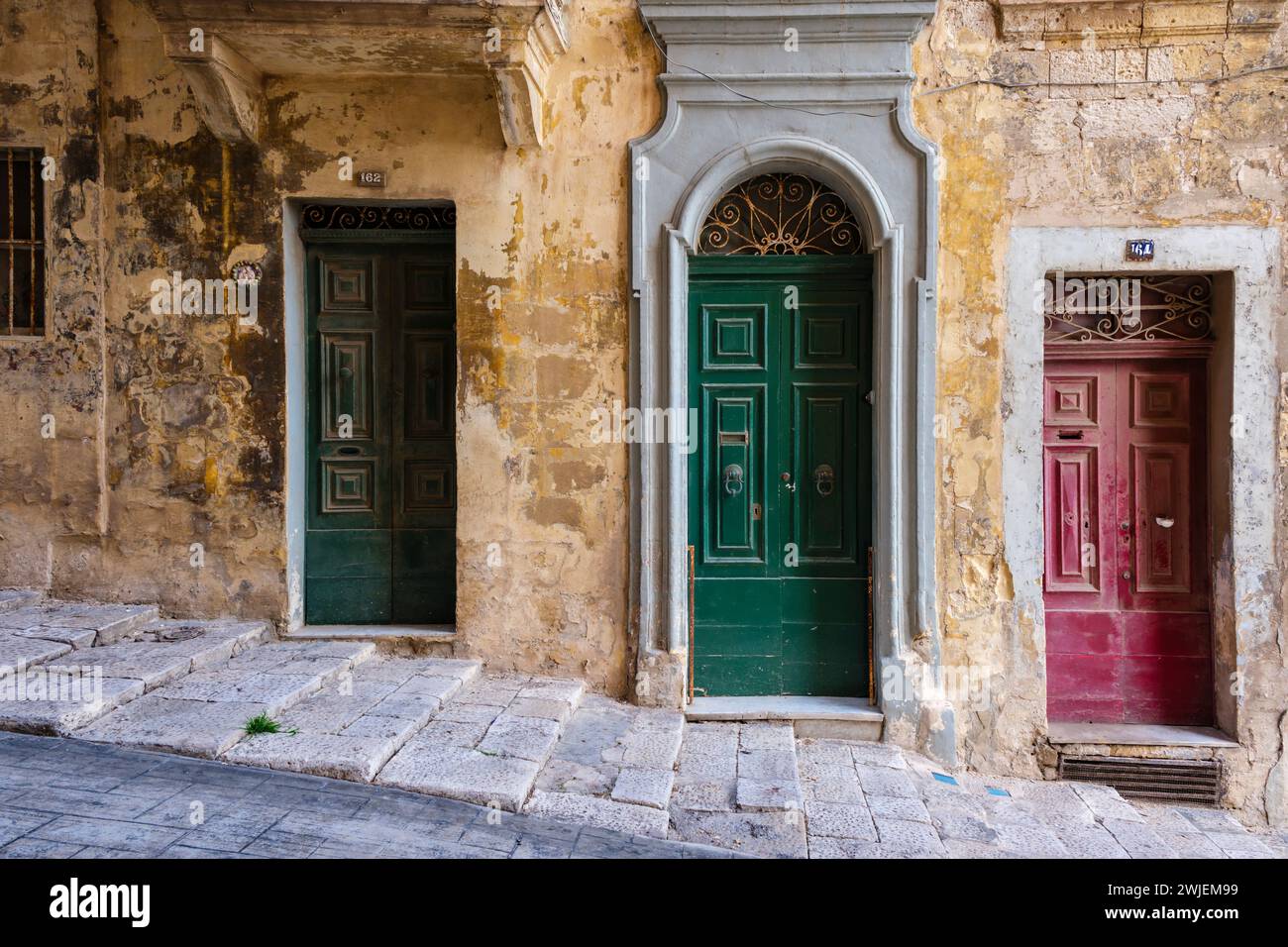 Typical Maltese doors in the back streets of Valletta, Malta Stock ...