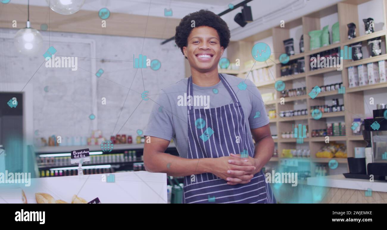 Image of business icons over biracial male shop assistant smiling Stock ...