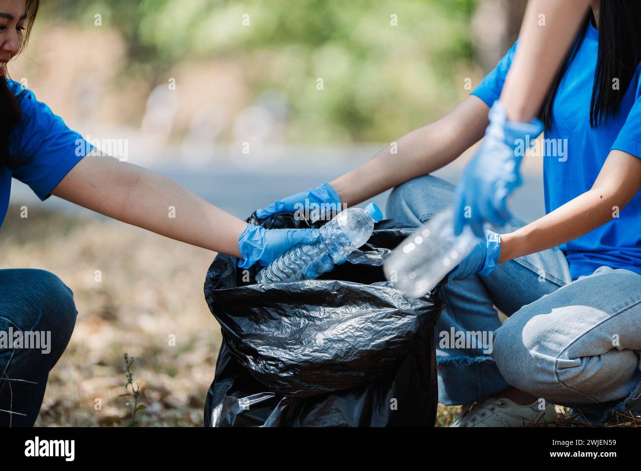 Group of volunteers, community members cleaning the nature from garbage ...