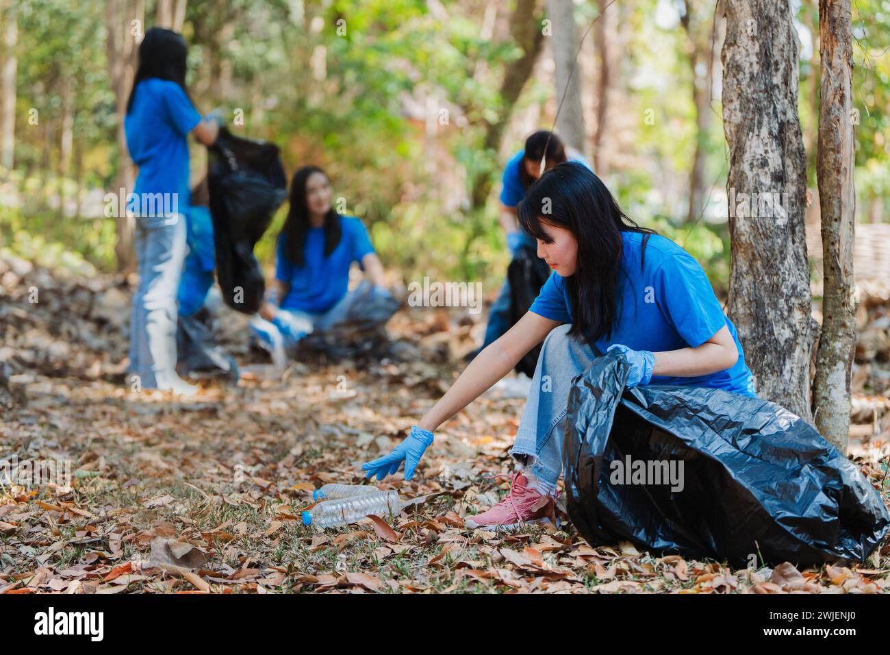 Volunteer team in nature for community service, teamwork and planning with leadership Stock ...
