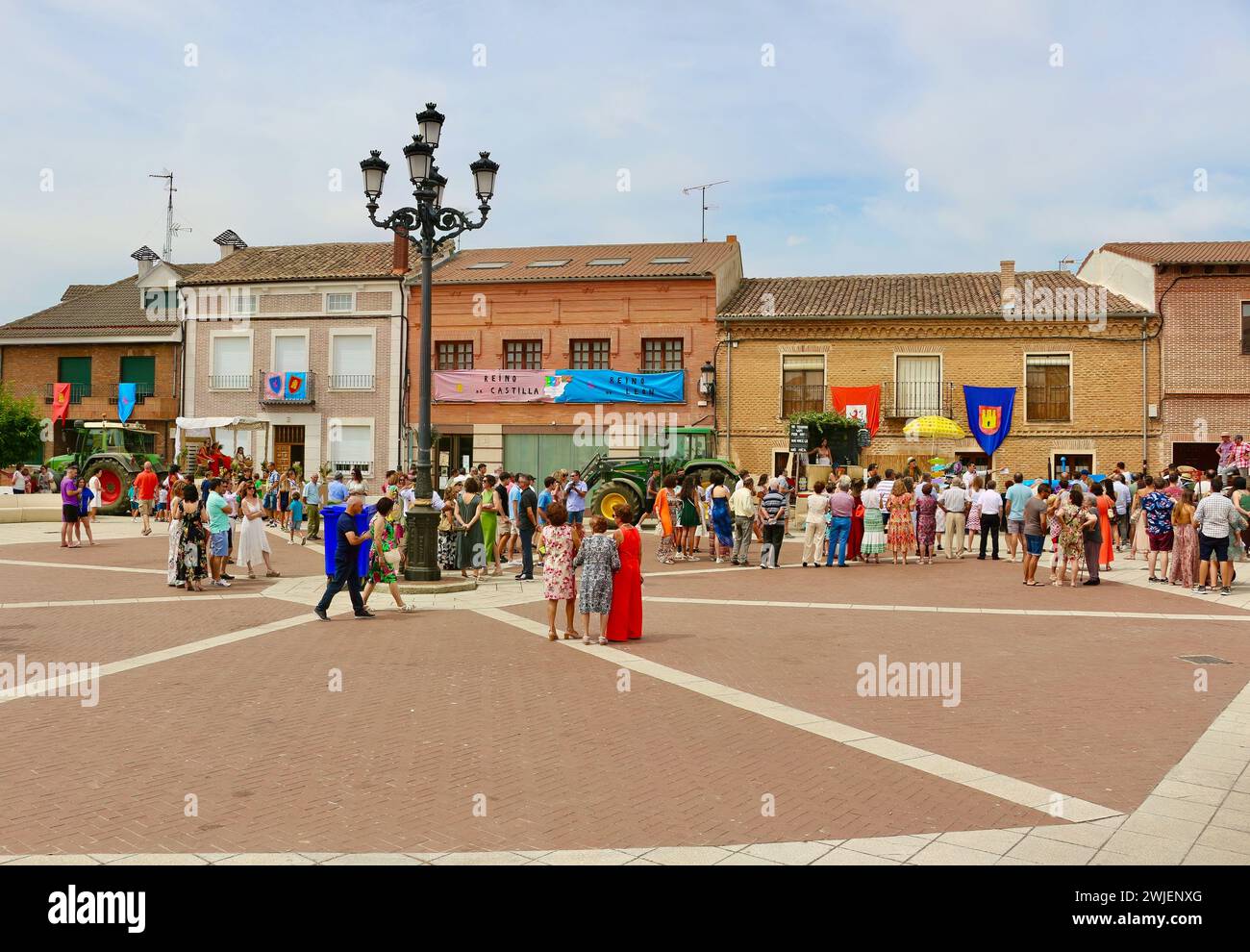 The town square full of villagers during the summer parties in August ...