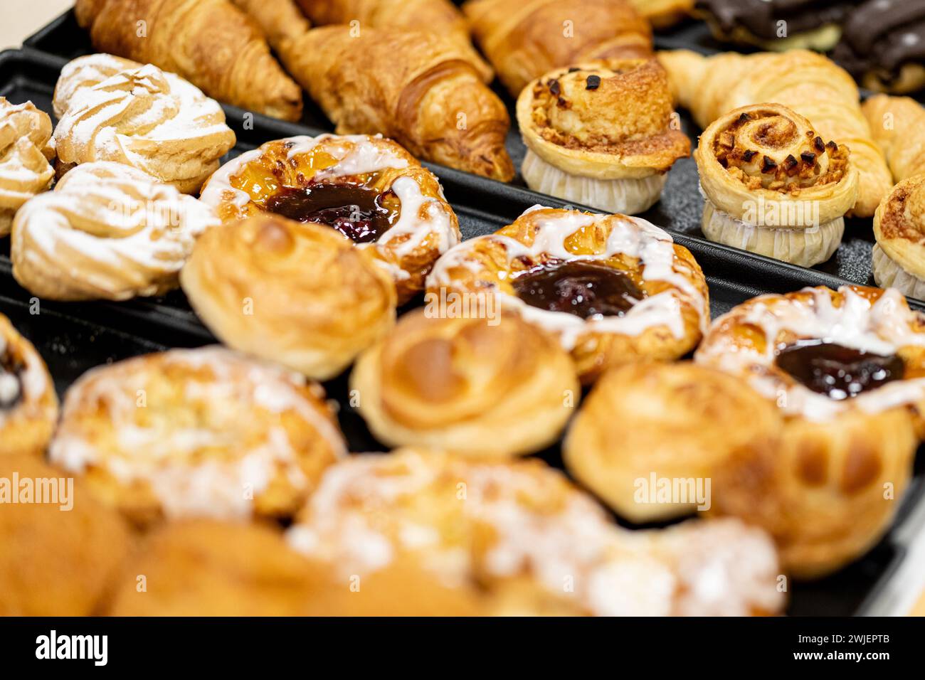 Berlin, Germany. 15th Feb, 2024. Pastries are lined up on a table ...