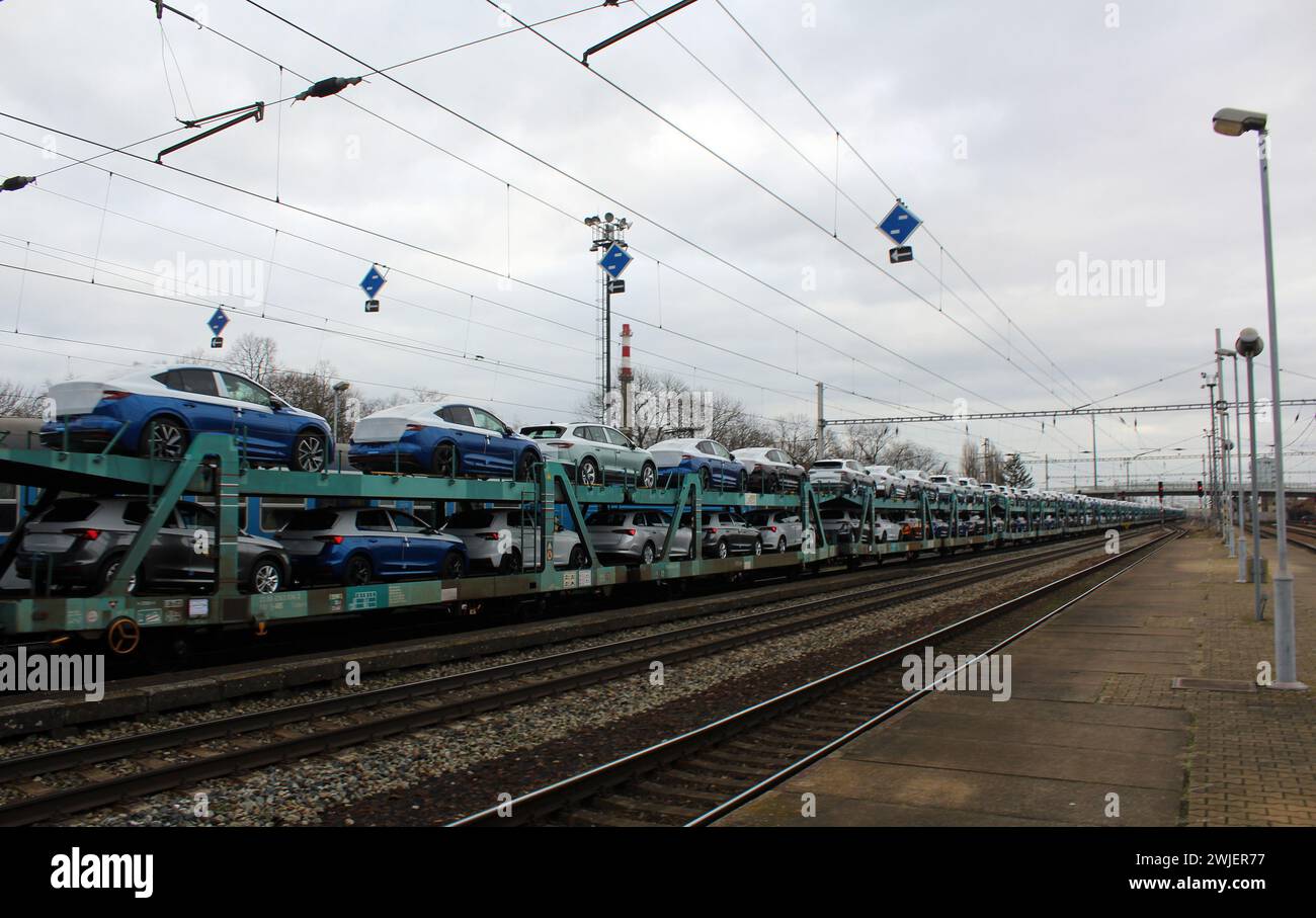 Double deck car carrier wagons with new Skoda cars passes through Lysa ...