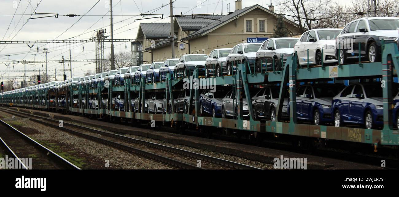 Double deck car carrier wagons with new Skoda cars passes through Lysa ...