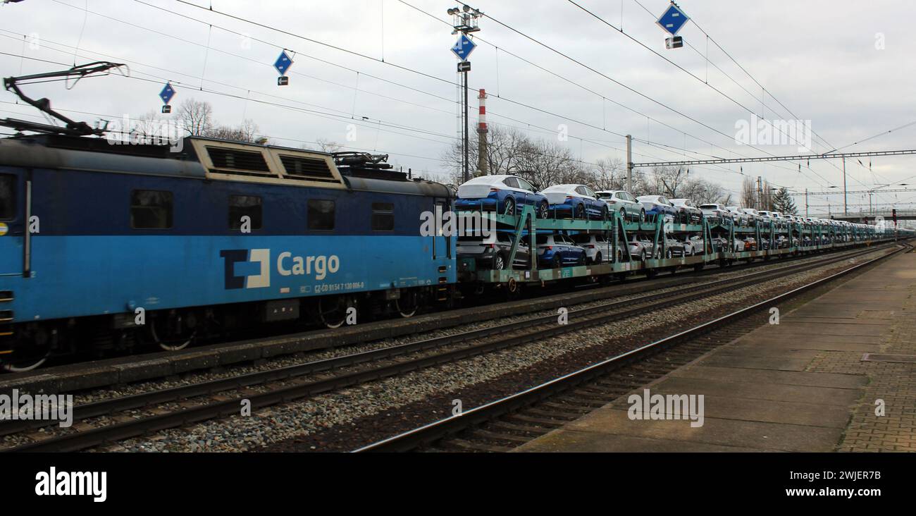 Double deck car carrier wagons with new Skoda cars passes through Lysa ...