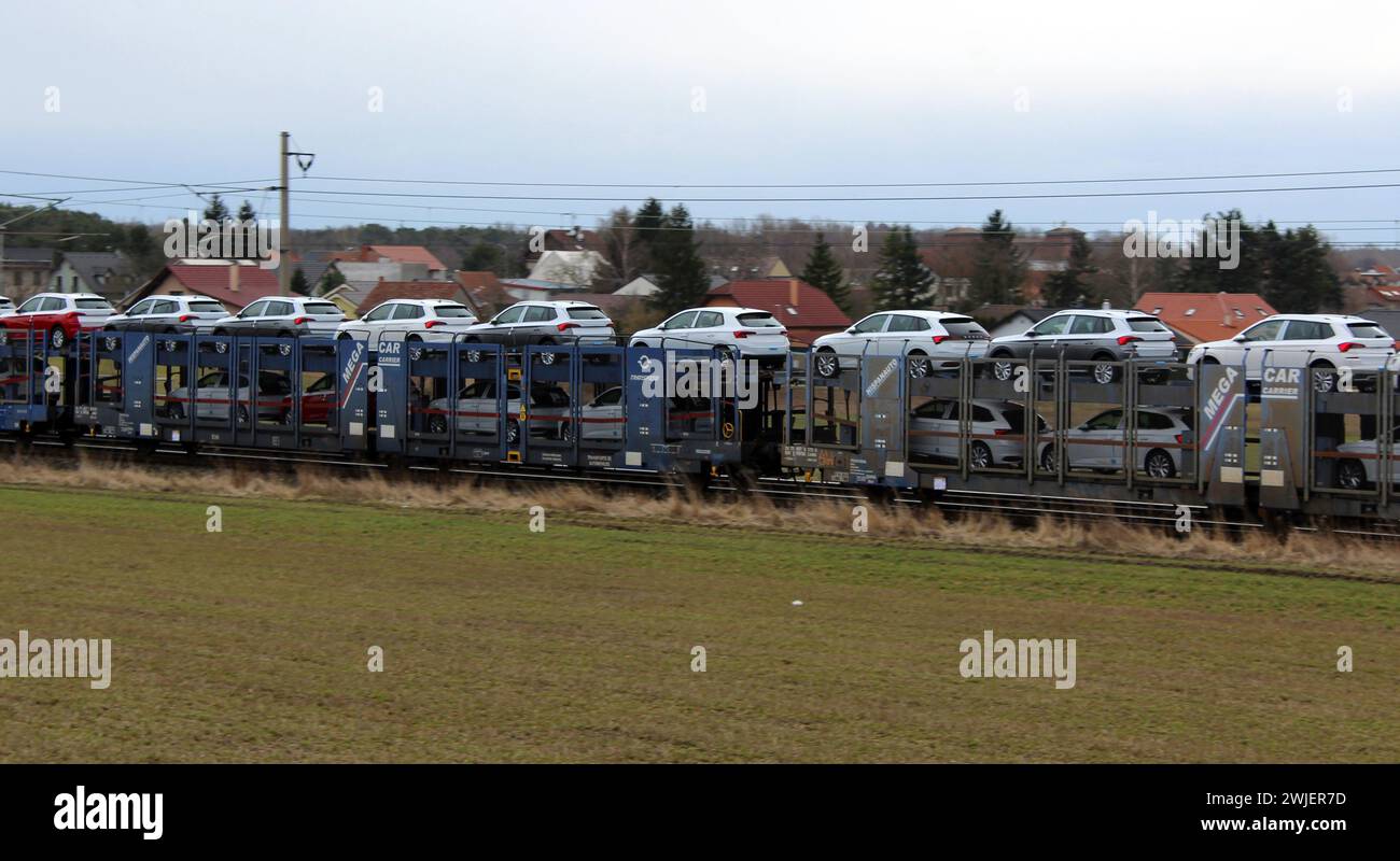 Double deck car carrier wagons with new Skoda cars passes through Lysa ...