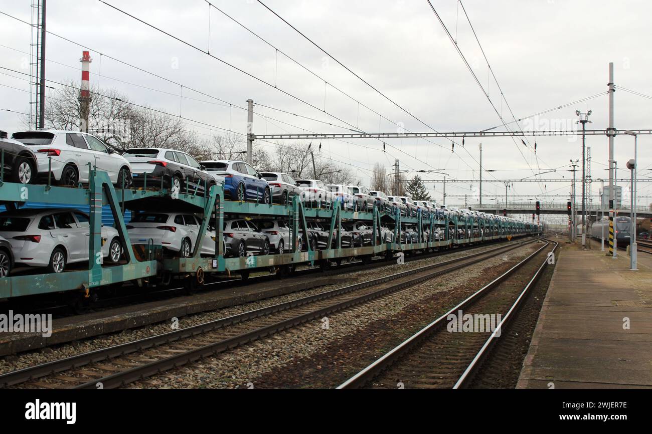 Double deck car carrier wagons with new Skoda cars passes through Lysa ...