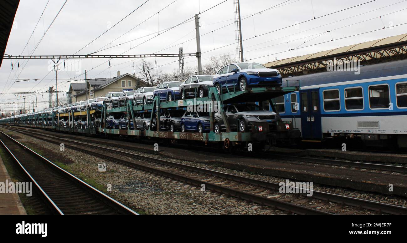 Double deck car carrier wagons with new Skoda cars passes through Lysa ...