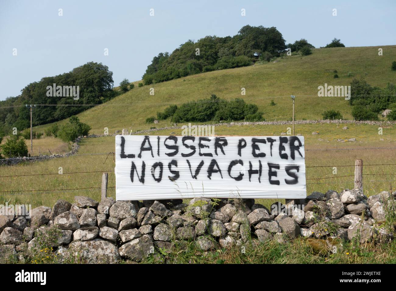 “Let our cows fart banner on the Aubrac plateau, in south of France ...