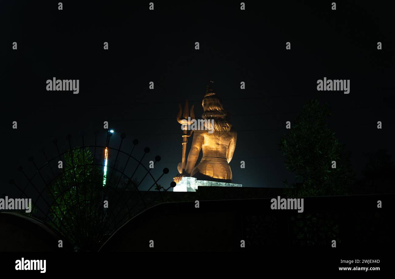 back view of hindu god lord shiva isolated statue at night from ...