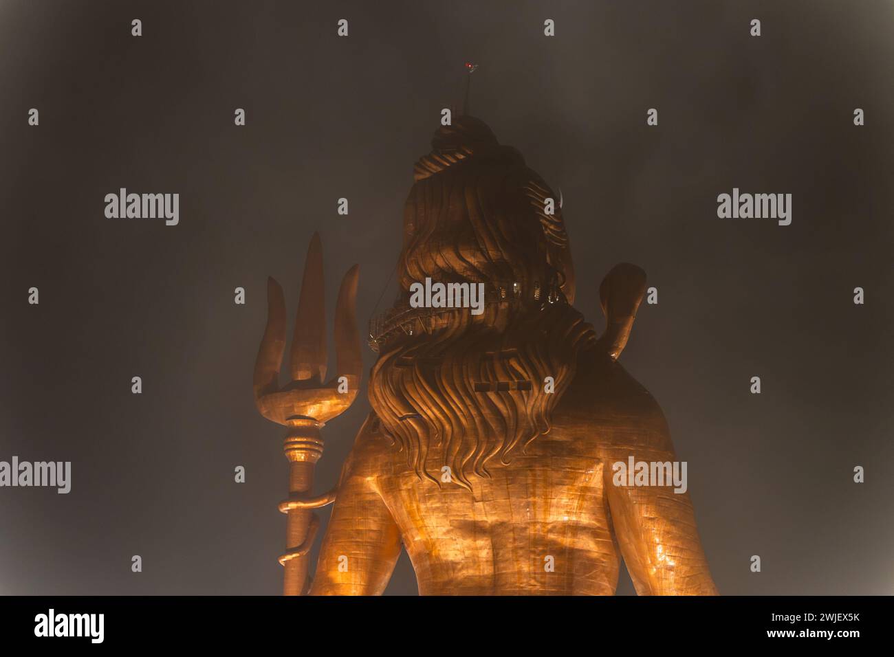 back view of hindu god lord shiva isolated statue at night from ...