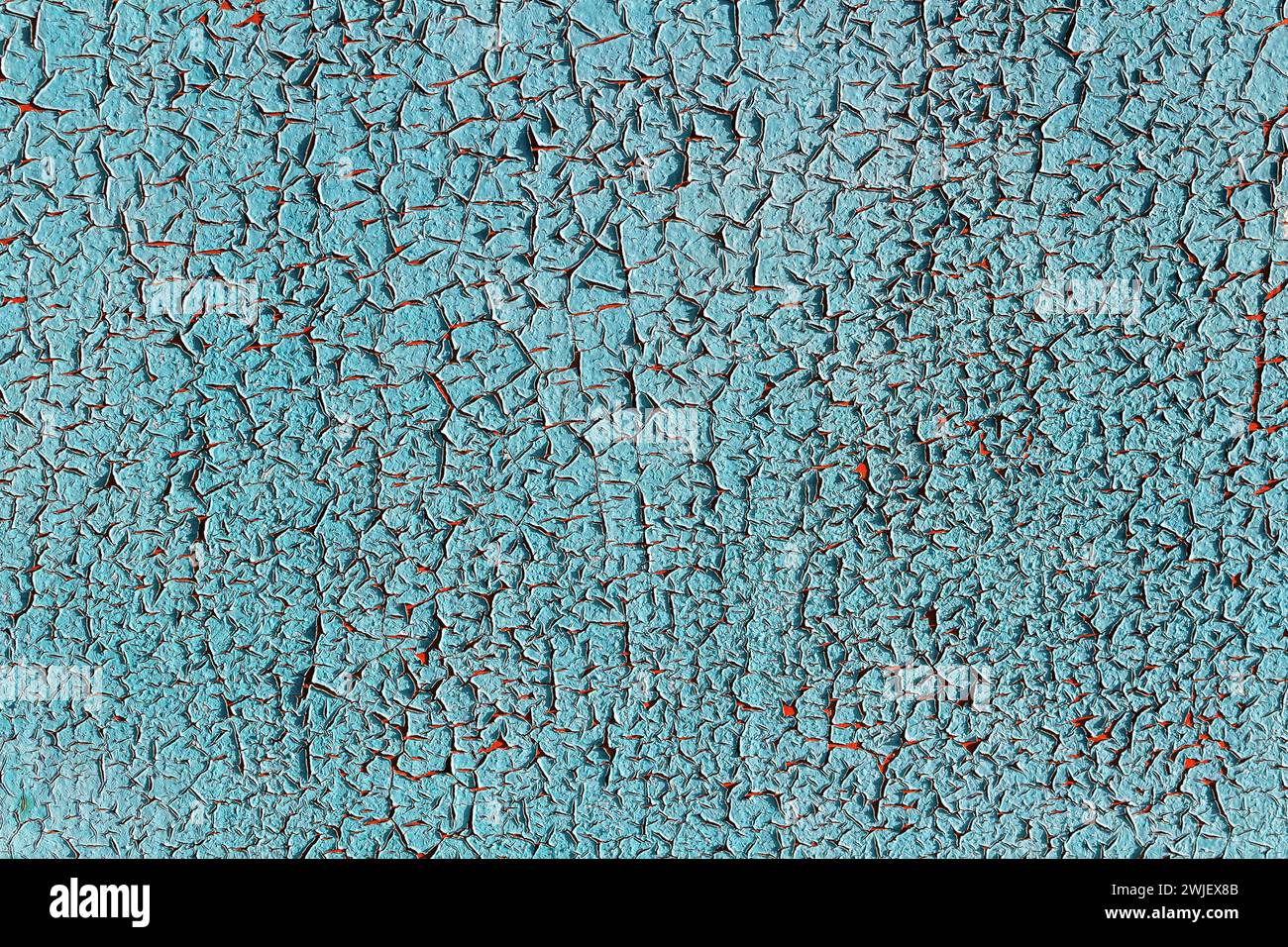 Old blue cracked paint pattern on wall. Damaged paint. Wall covered ...