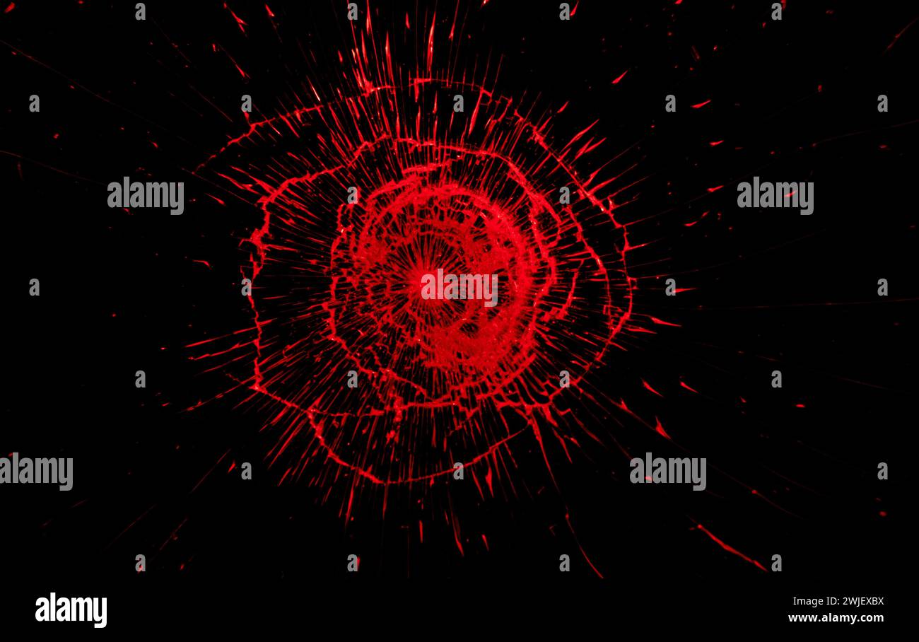 Red crack in broken window on black background. Broken glass texture ...