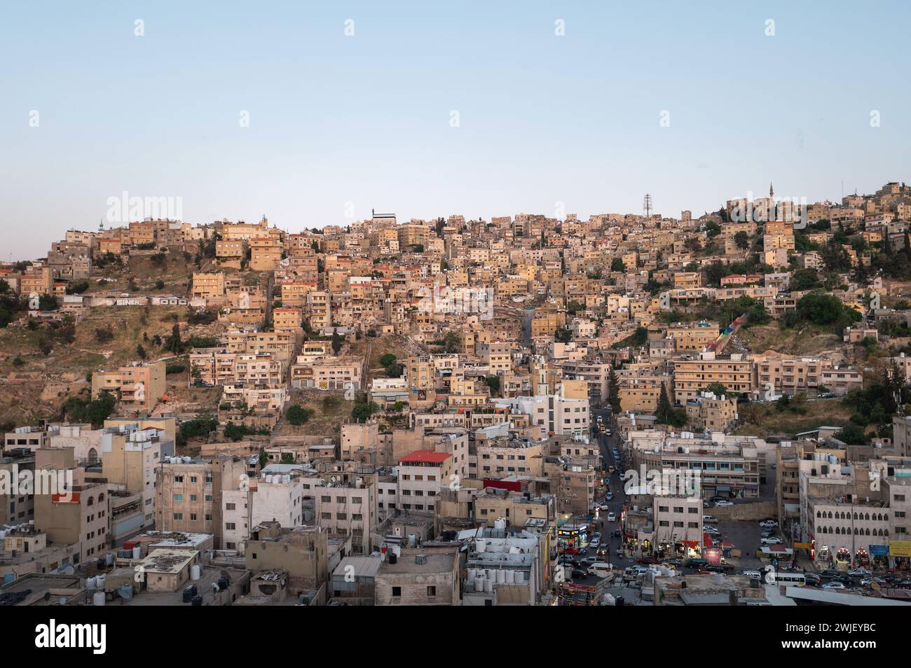 A breathtaking skyline of modern buildings and traditional houses on a ...