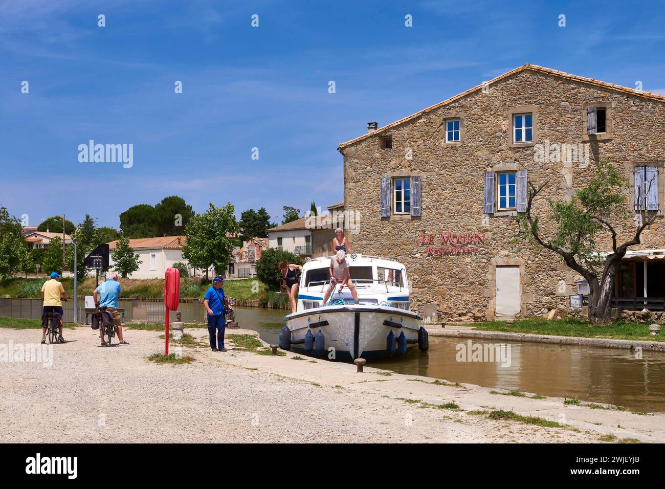 Trebes (south of France): river barge on the triple lock of Trebes on ...