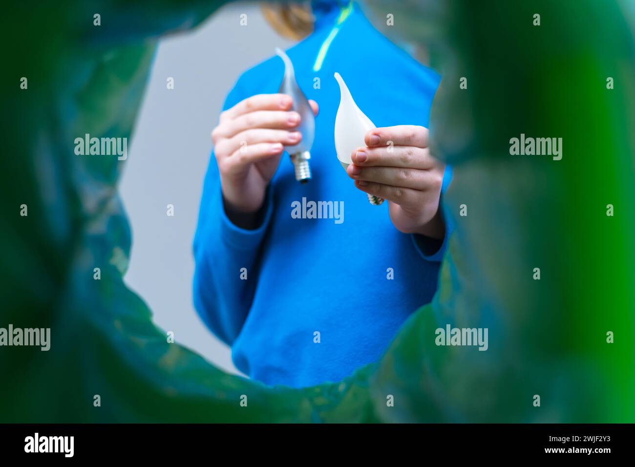 Low angle view hands male sorting plastic bottles in recycle bin in ...