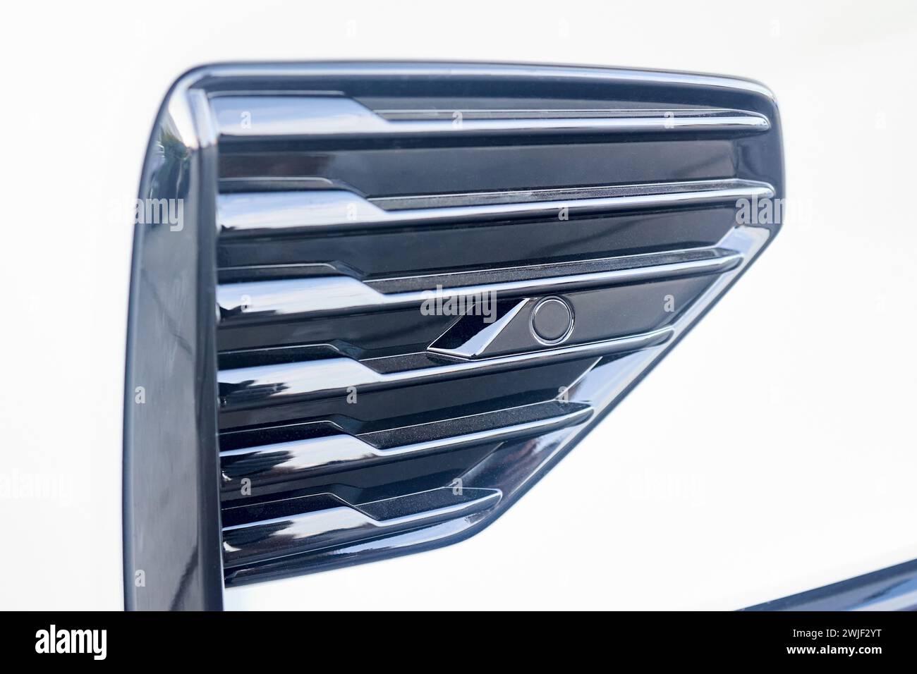 Selective focus on left side of front bumper decorative element parking ...