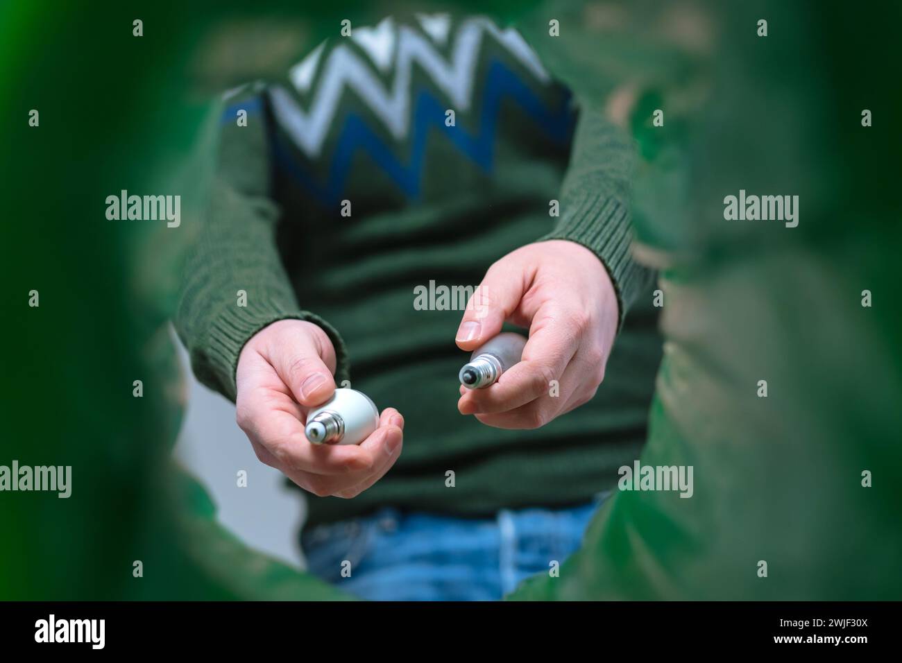 Low angle view hands male sorting plastic bottles in recycle bin in ...