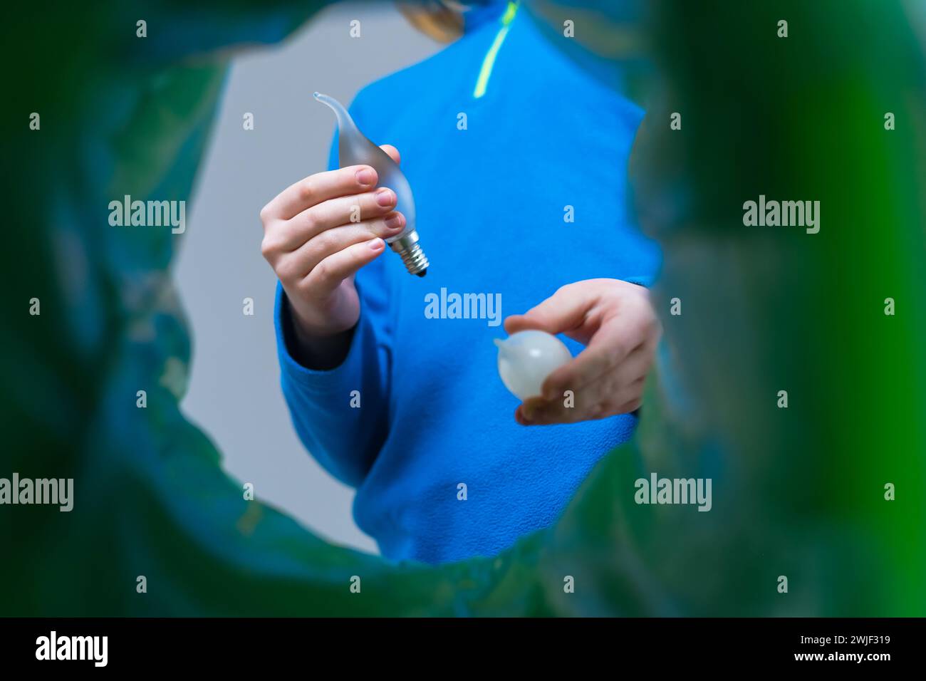 Low angle view hands male sorting plastic bottles in recycle bin in ...