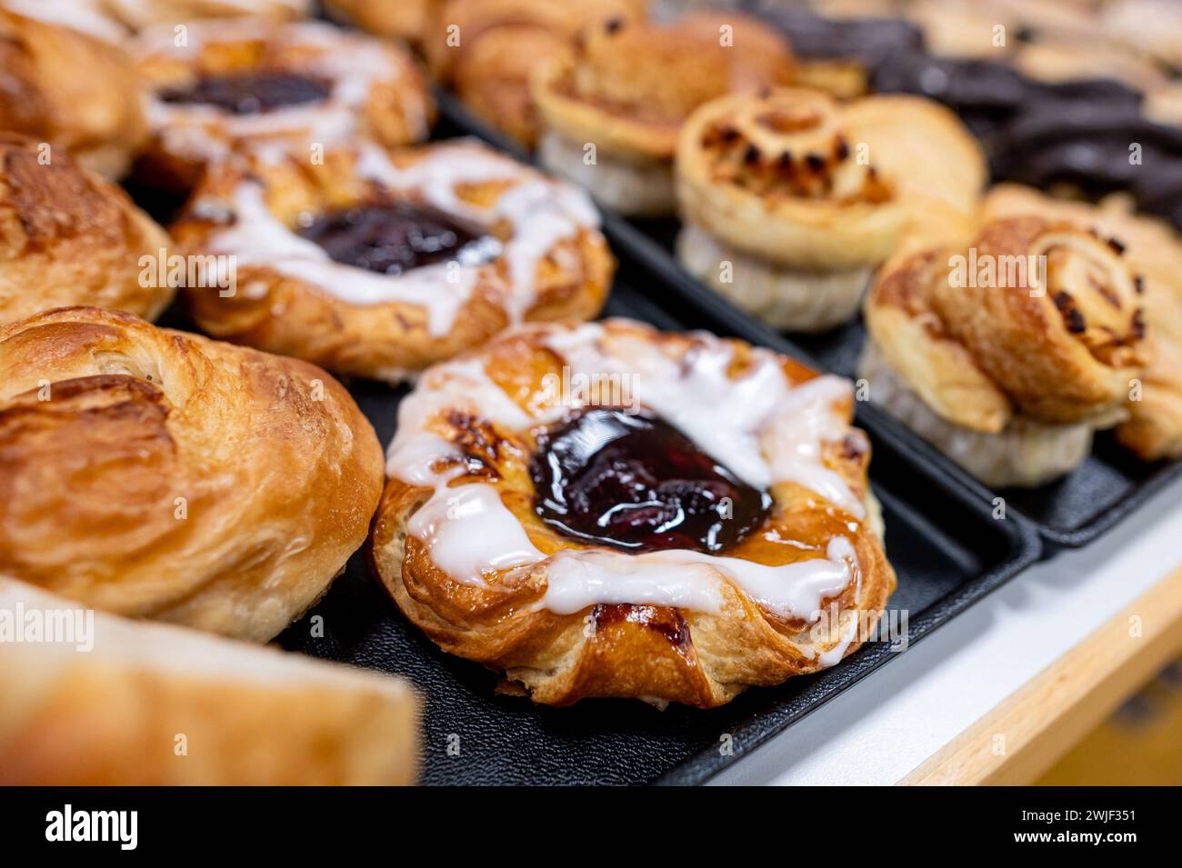 Berlin, Germany. 15th Feb, 2024. Pastries are lined up on a table ...
