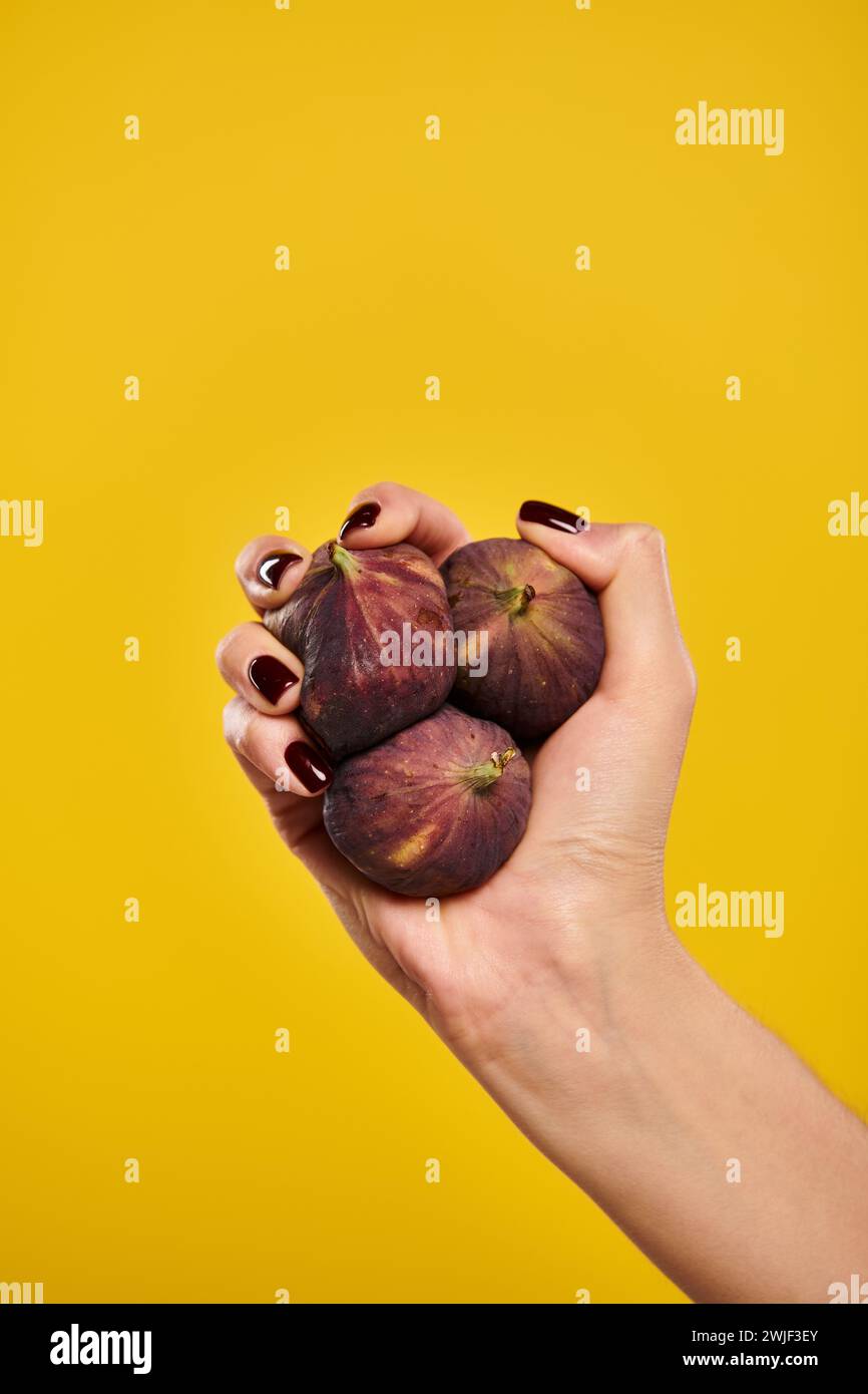 Figs in hand hi-res stock photography and images - Alamy