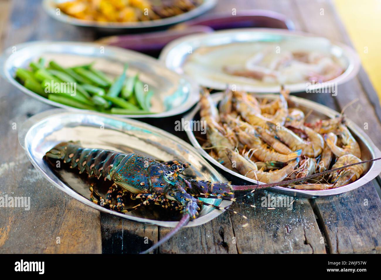 Seafood grill on the beach. Lobster, prawns and fish BBQ. Healthy lunch ...