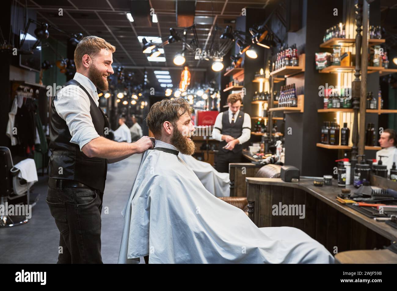 Regular client visiting favorite barbershop. Professional hairdresser ...