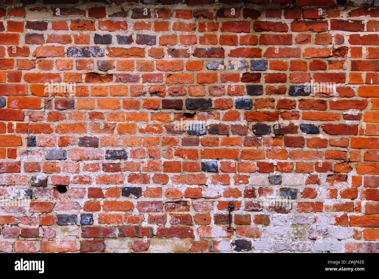 Red Brick wall aged bricks on farmland in West Horsley, Surrey, England ...