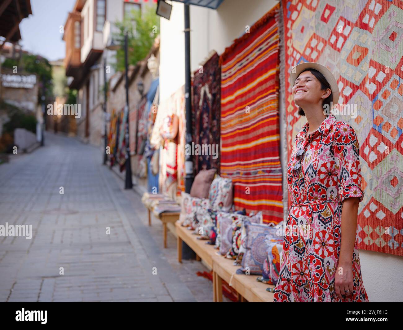female summer travel to Antalya, Turkey. young asian woman in red dress ...