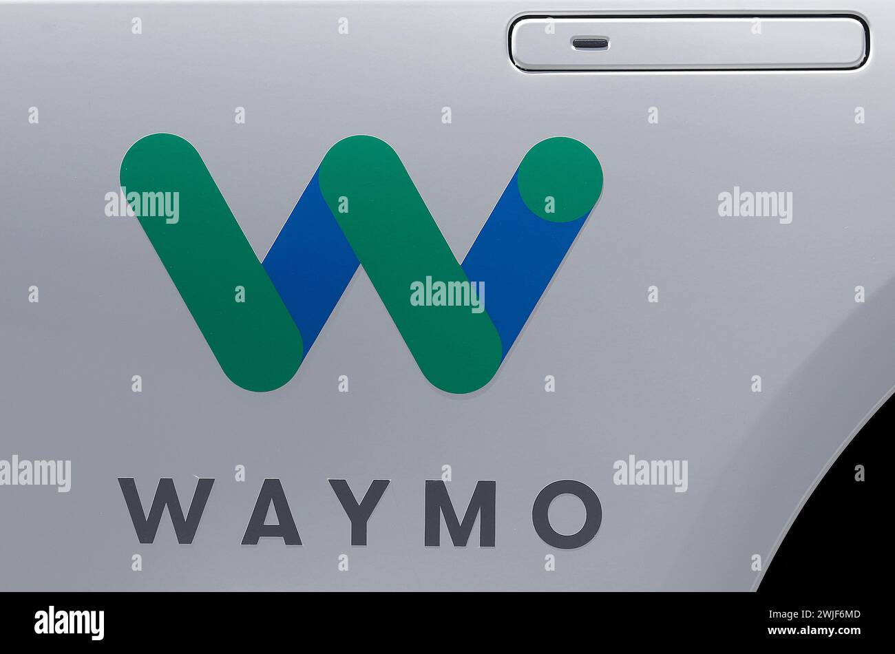 FILE - In this May 8, 2018, file photo, a Waymo logo is displayed on ...