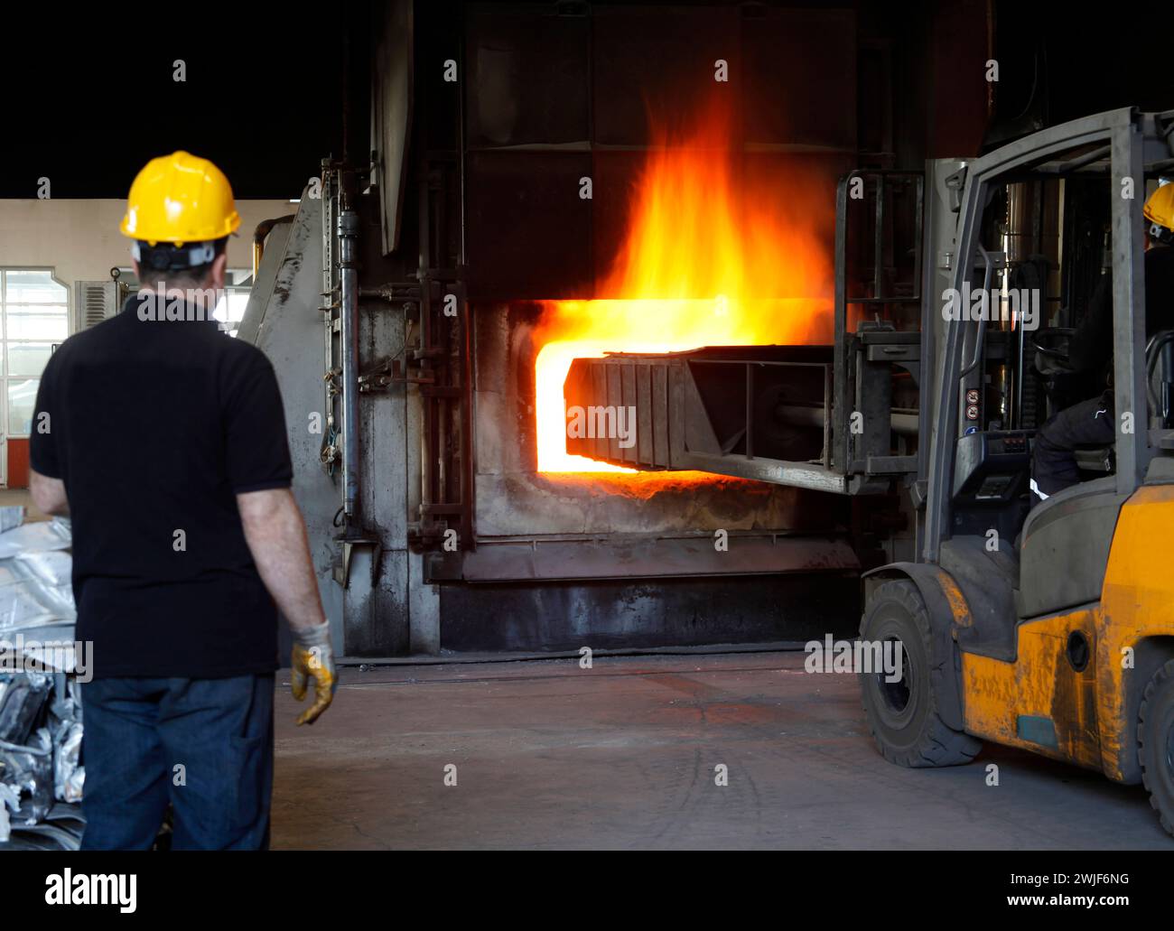 Carrying molten metal in forklift Stock Photo - Alamy