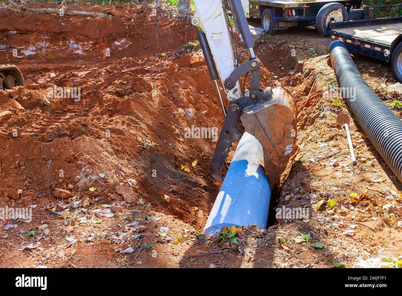 At construction site, pipes are being laid to allow rainwater to flow ...