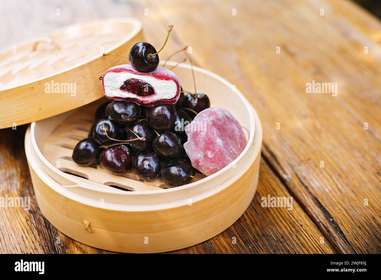 Wooden bowl with cherries and ice cream a sweet and fruity dessert dish ...