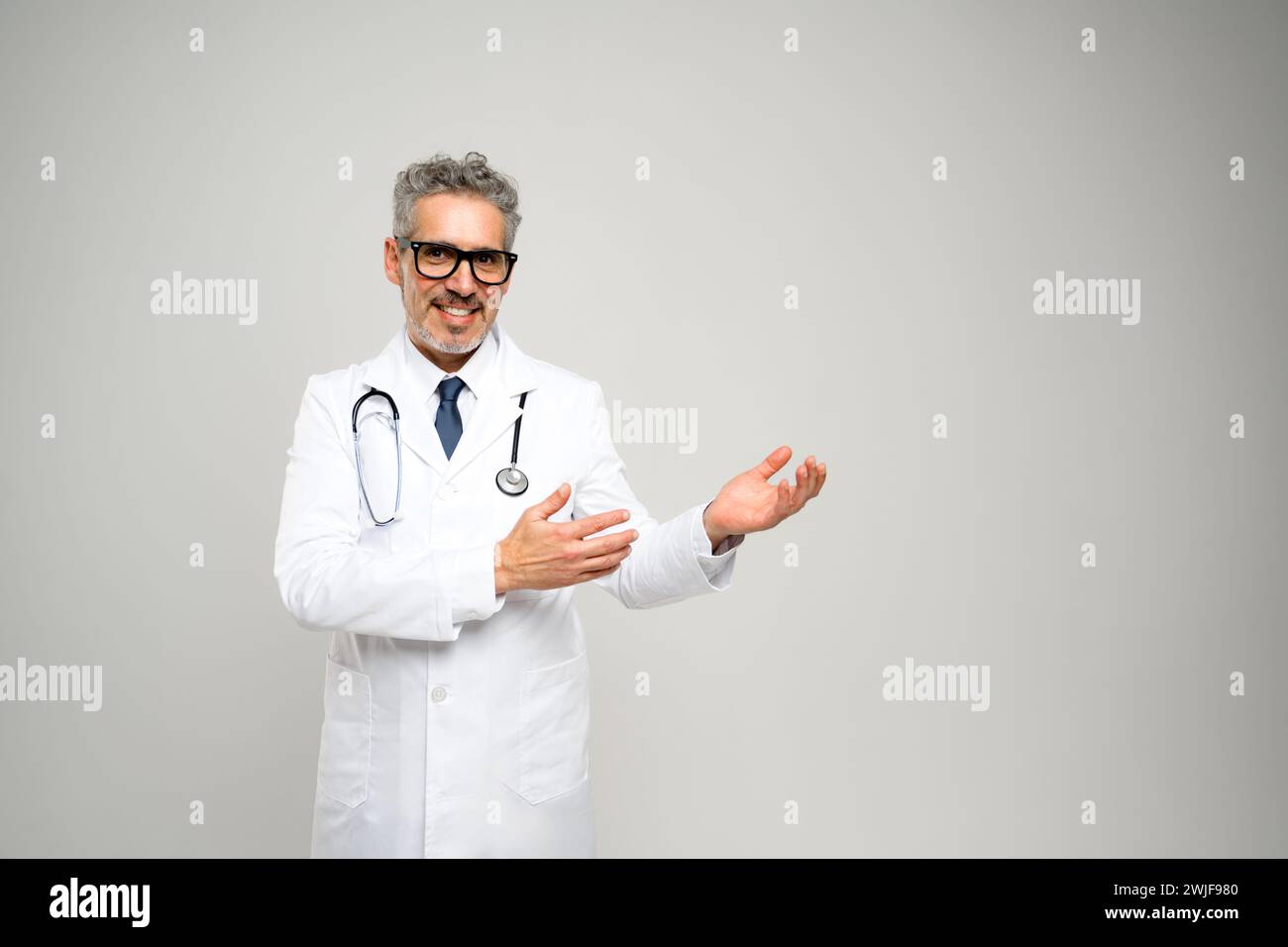 Healthcare professional extends welcoming hi-res stock photography and ...