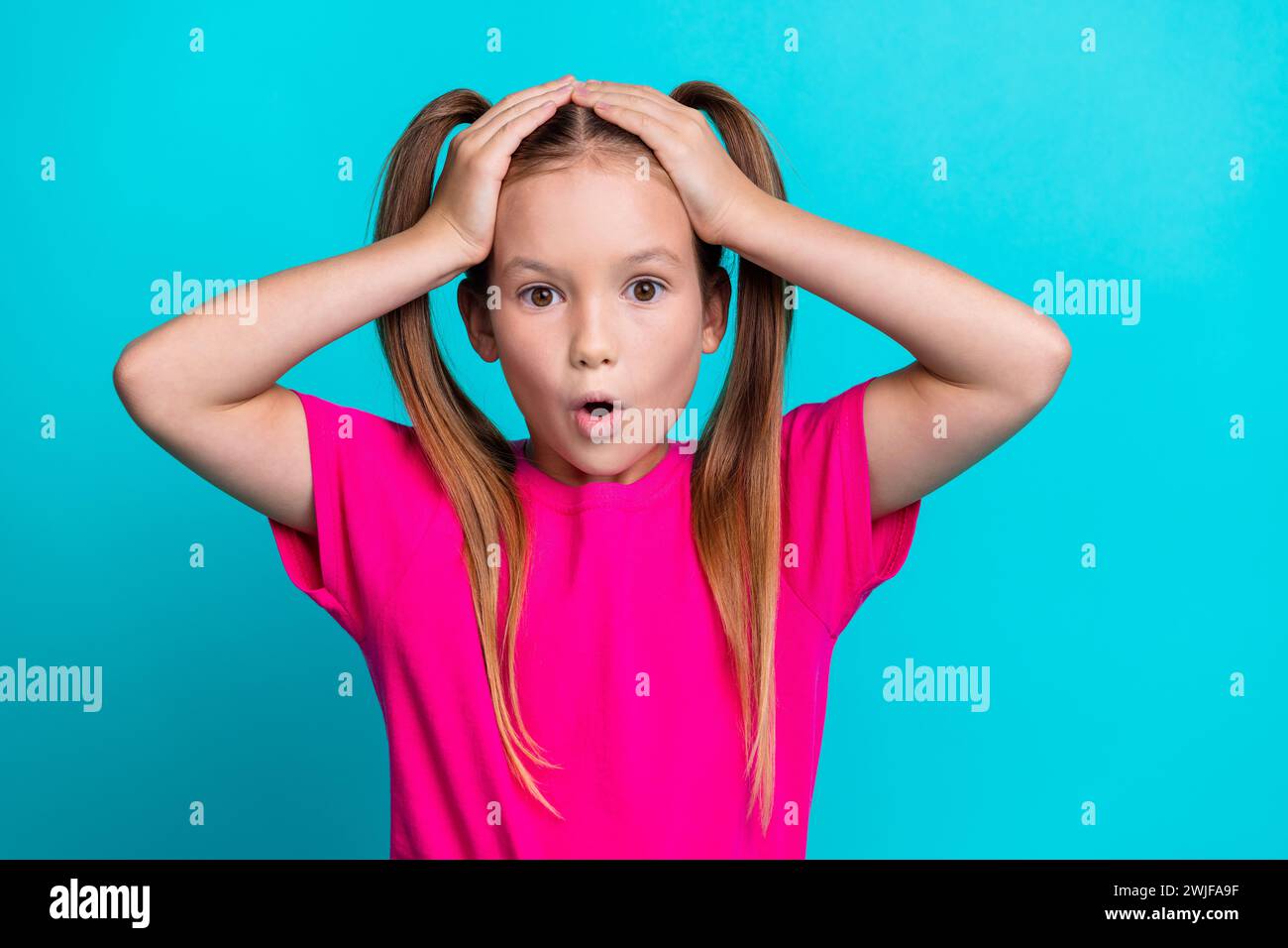 Photo of speechless impressed schoolkid hands touch head open mouth ...