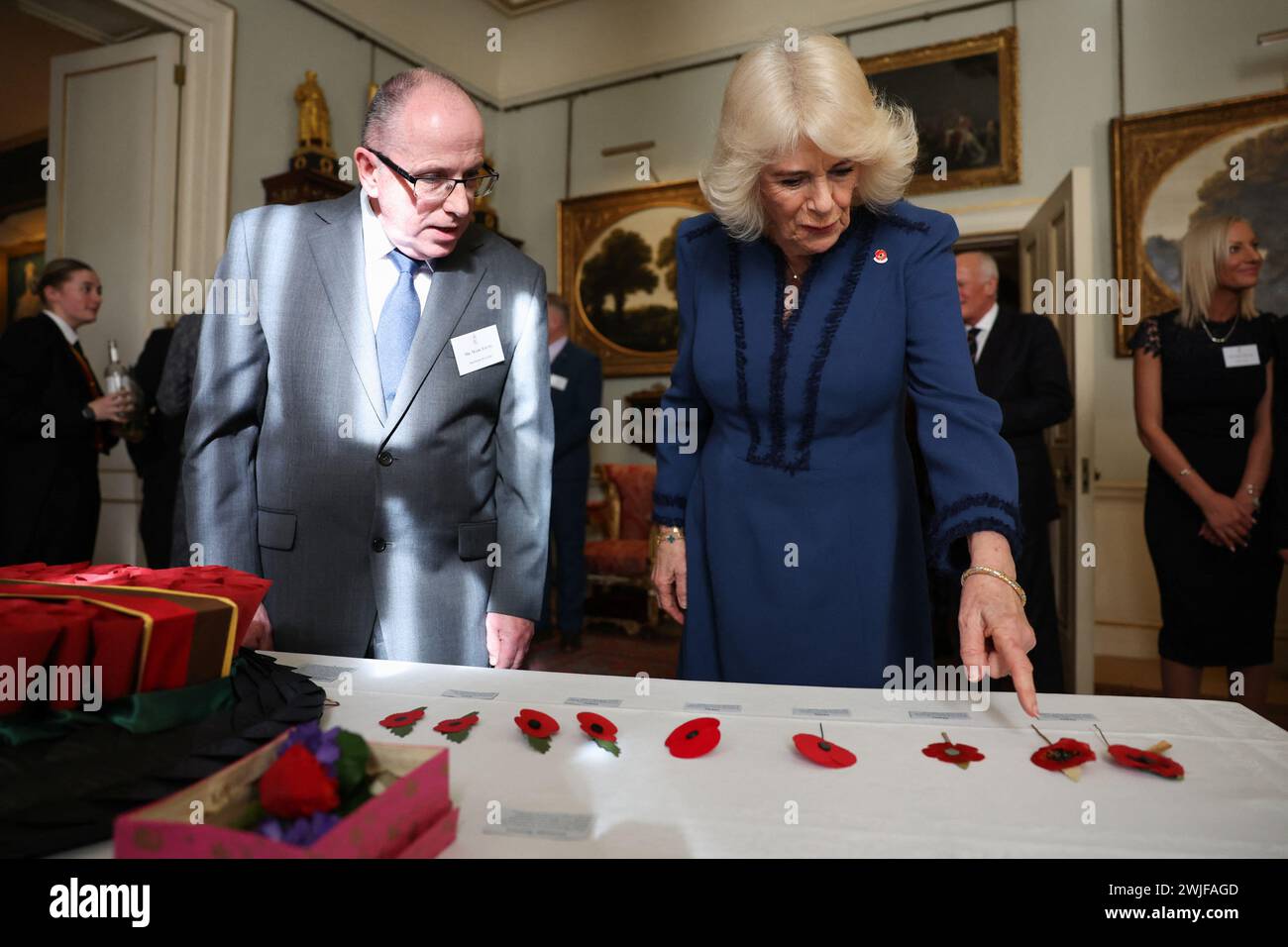 Queen Camilla views an exhibition of poppies and wreaths showing the ...
